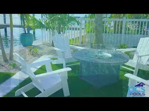Madeira Beach waterfront oasis with linear pool, spa, and turf