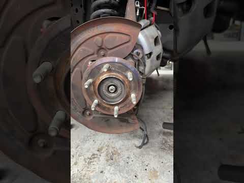 Ford Expedition front end shake while braking turned out to be bad CV joint and lower ball joint.