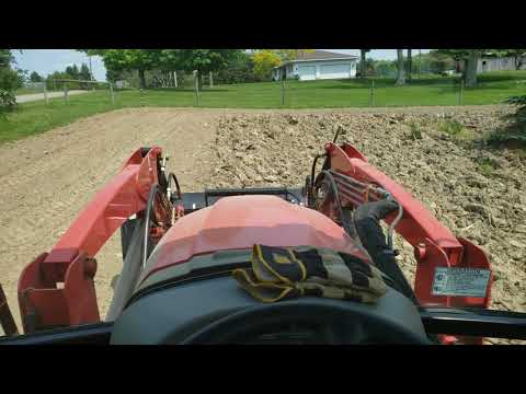 Using my RK 55 tractor to rototill what I have plowed for my sweetcorn.