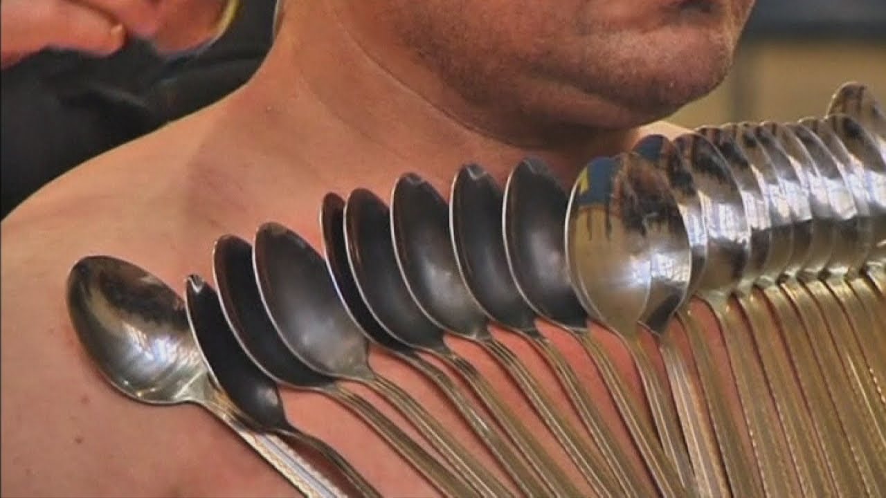 Magnetic man Etibar Elchyev sets world record for most spoons attached ...