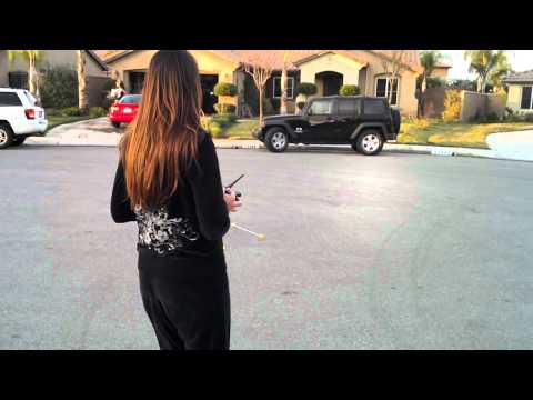 girl learning to fly RC Heli with training POD