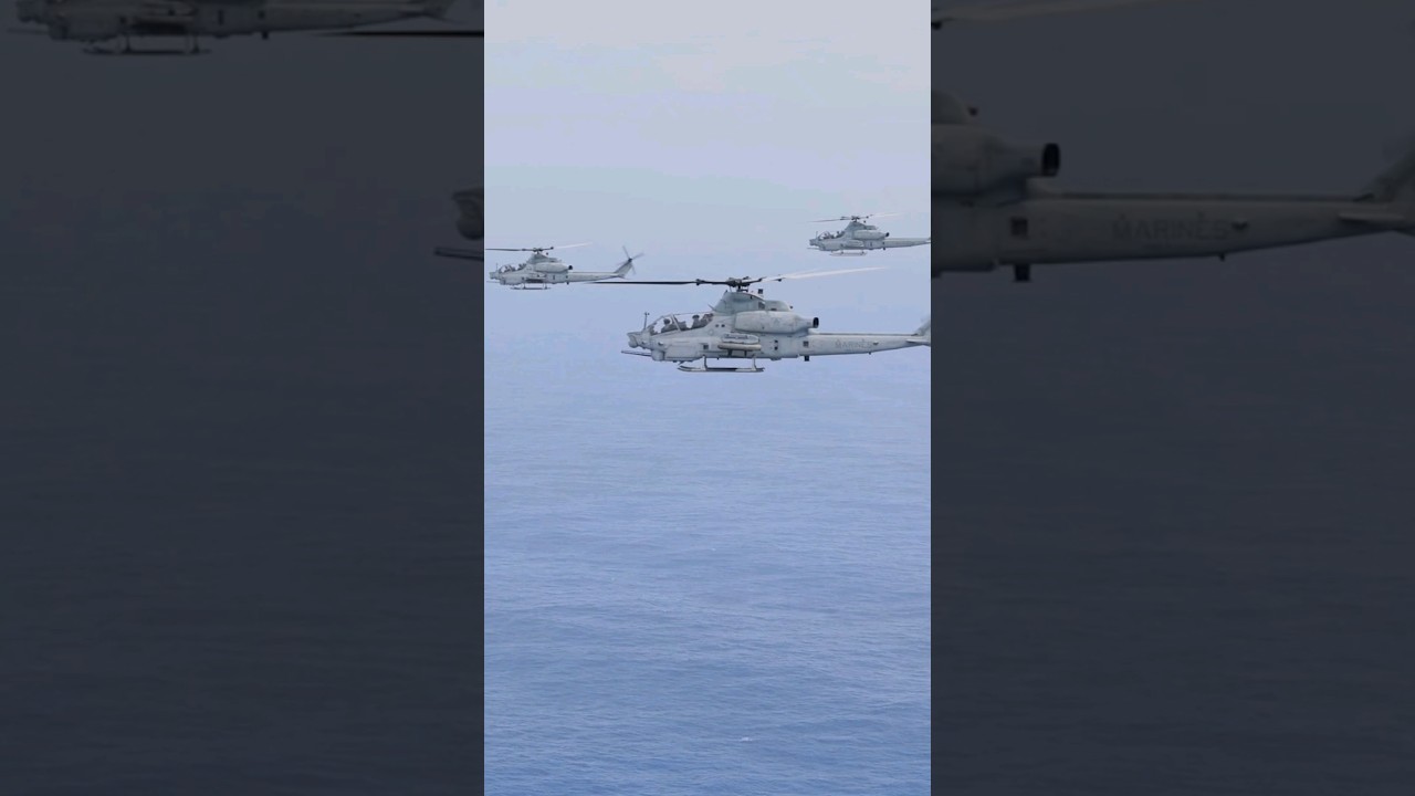 U.S. Marine Corps UH-1Y Venom helicopters and AH-1Z Viper attack helicopters fly in formation