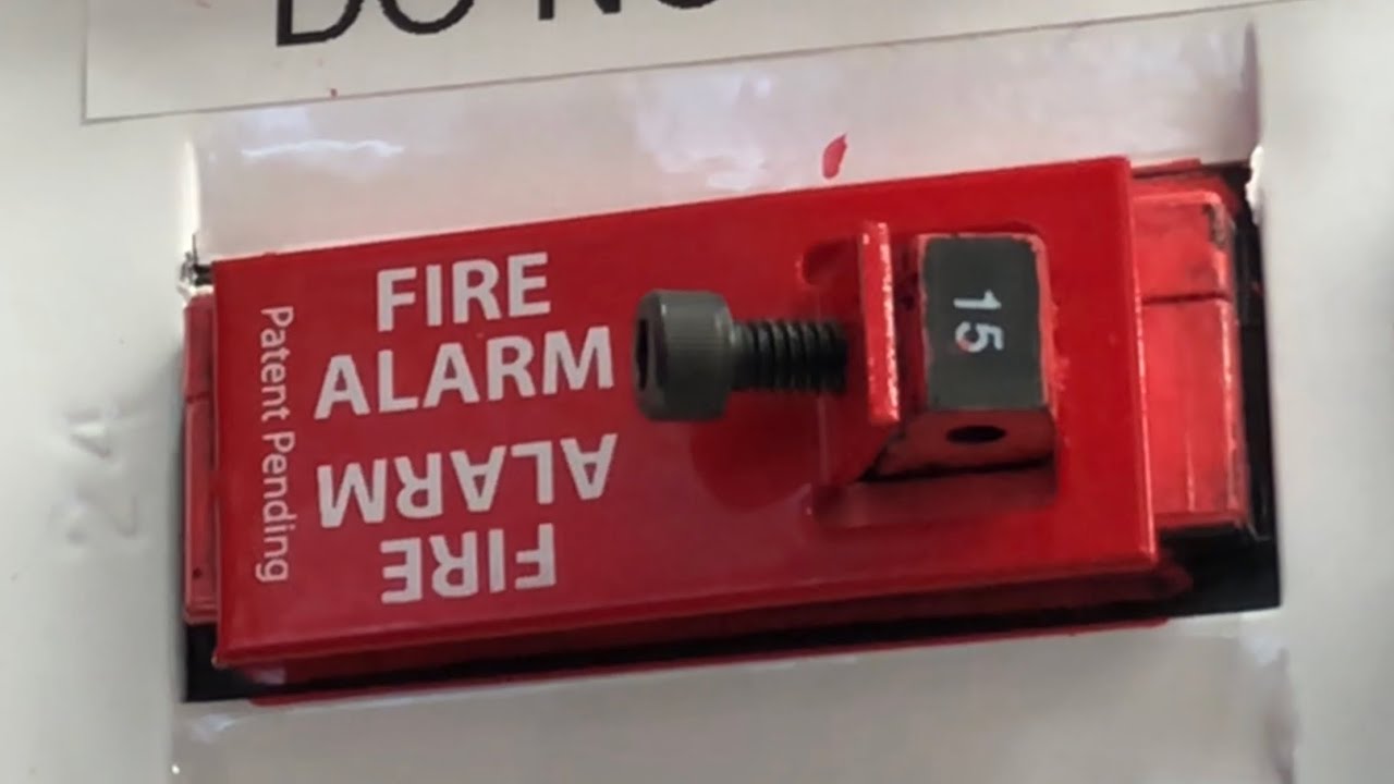 Installing a fire alarm circuit breaker lock on