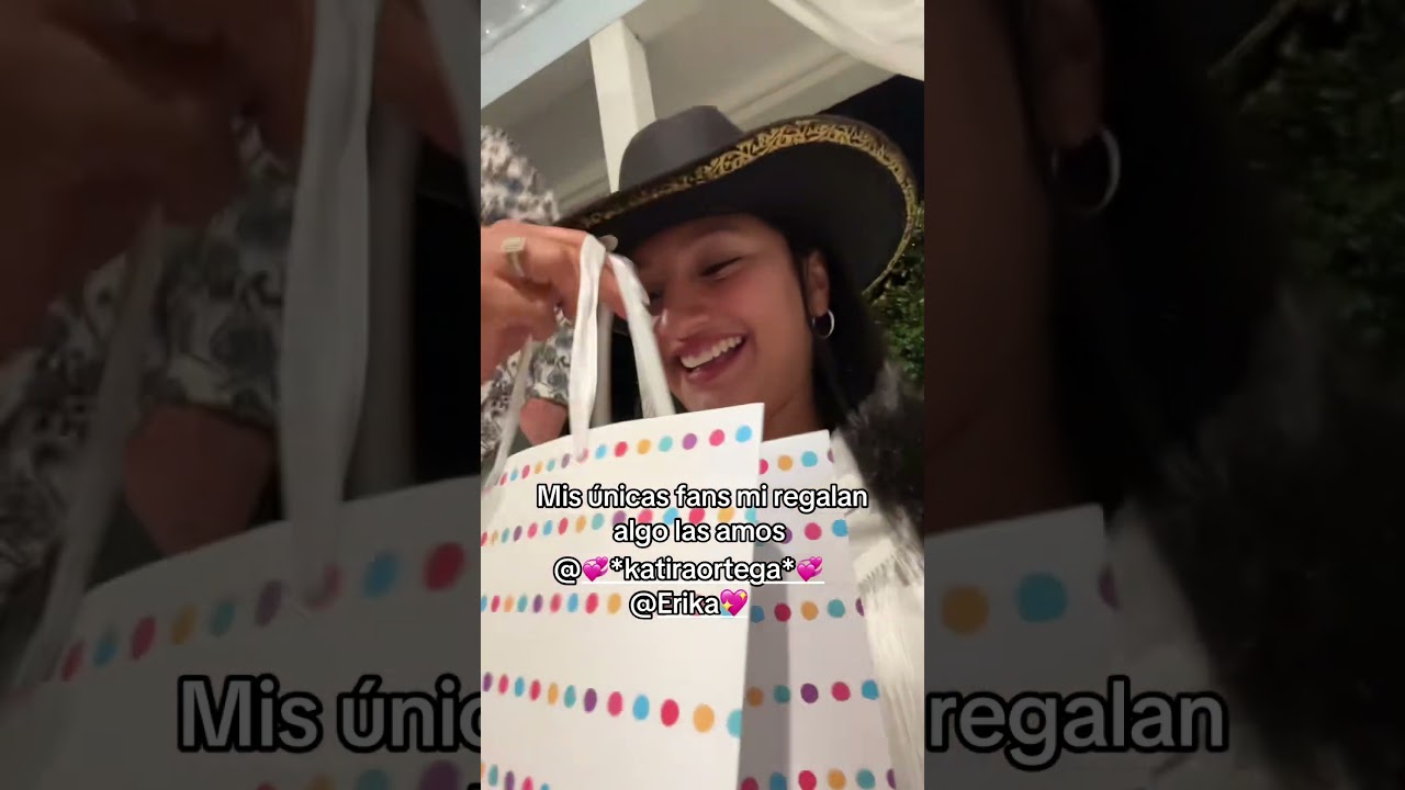 Enthusiastic Celebration: Woman Receives a Gift and Expresses Joy#Celebration