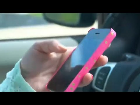 Keep hands off your phone while driving - it's the law