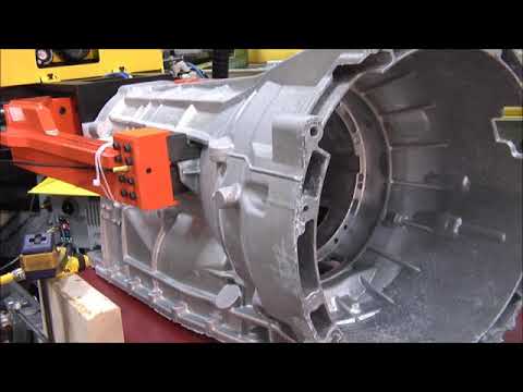 ABB-6650S Robot Manipulates Pack Out Cell - Large Powertrain Casting
