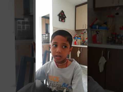 My grandson, deveish with his first telugu pathiyam, a telugu proverb