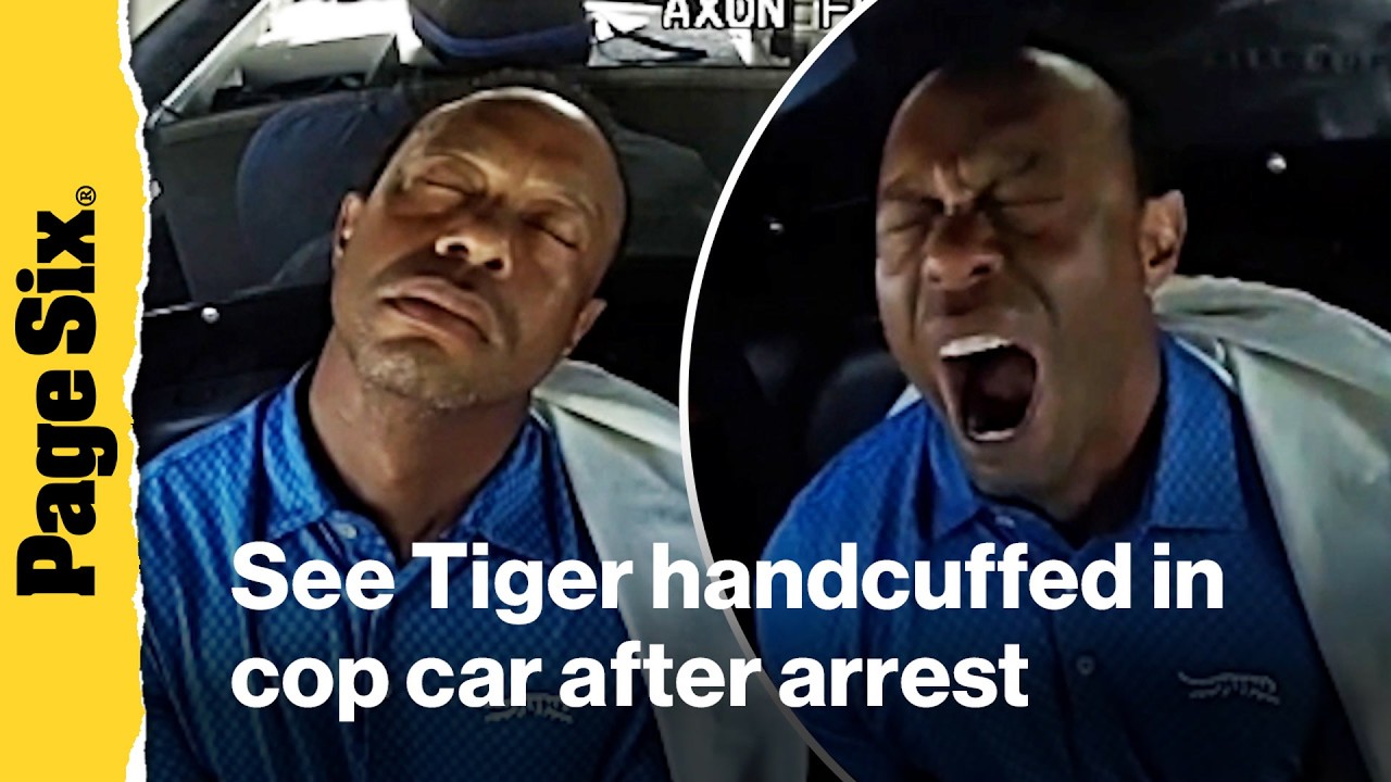 Handcuffed Tiger Woods looks irritated in cop car after rollover crash, DUI arrest