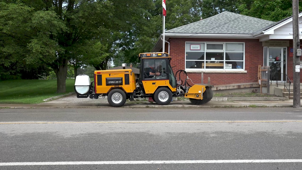 Articulating Sidewalk Tractor with Power Angle Sweeper