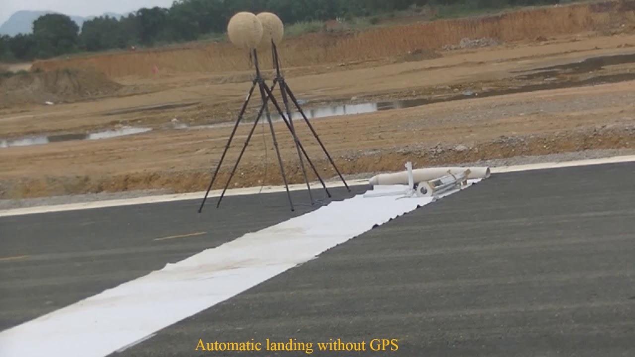 A Ground Based Near Infrared Camera Array System for UAV Auto Landing in GPS Denied Environment