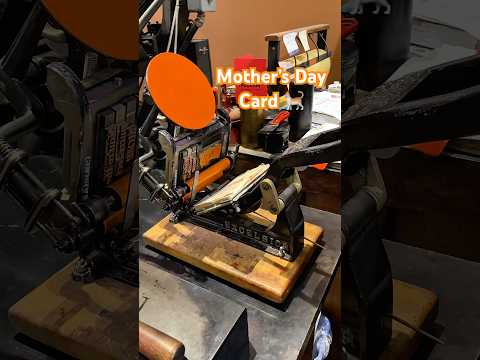 Letterpress printing orange greeting cards for Mother’s Day with a tabletop printing press