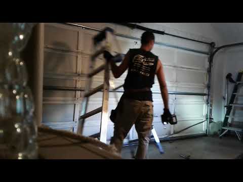 How to remove a 16 x 7 ft garage door alone