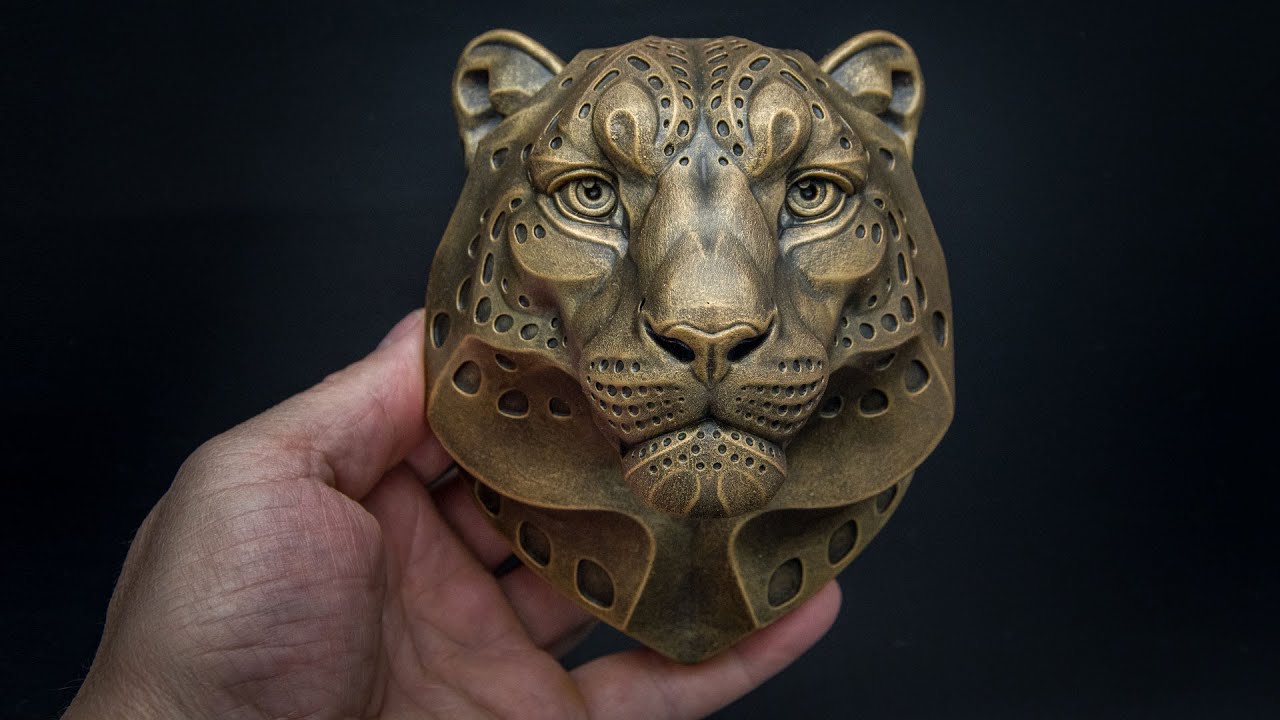 Snow Leopard stylized sculpture animal head. Bronze hand painted