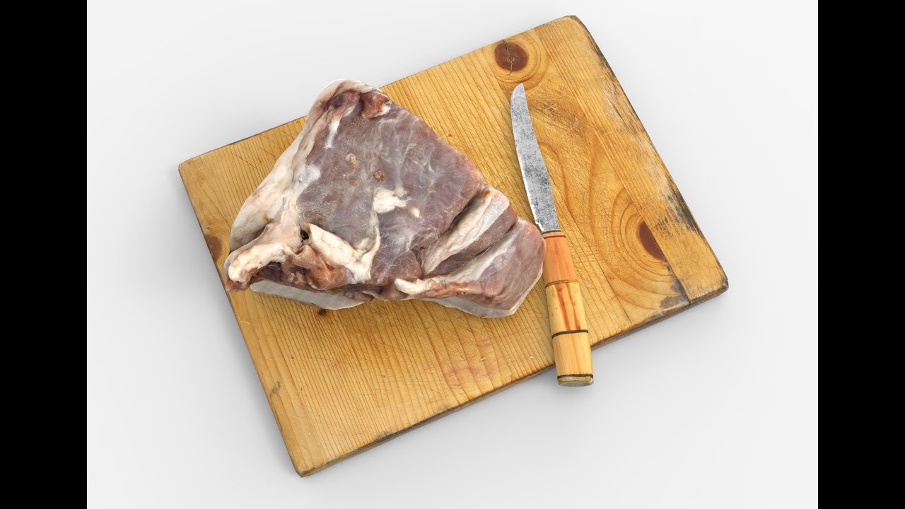 Kitchen desk with meat and knife