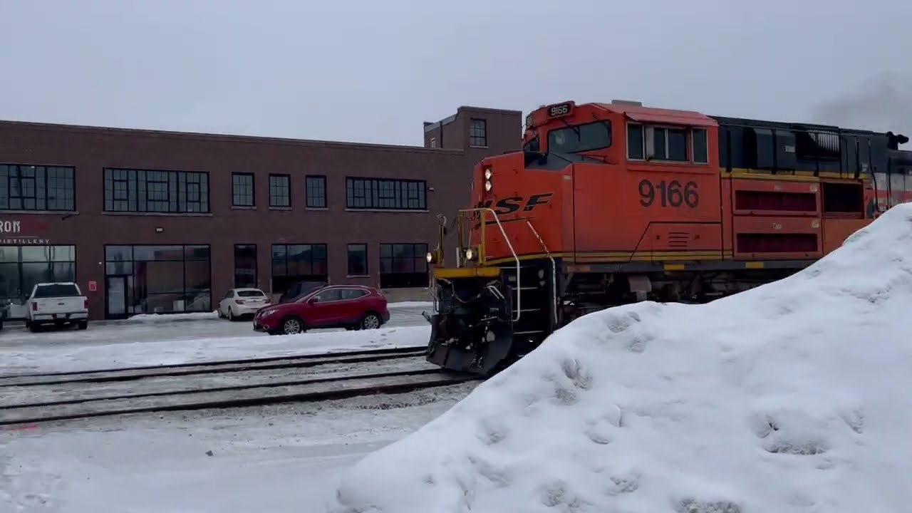 BNSF 9166 leads Eastbound C-BTMBEN with Thundercab unit.