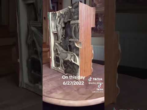 Book Carving/ free standing sculpture, made from large old animal stock book.