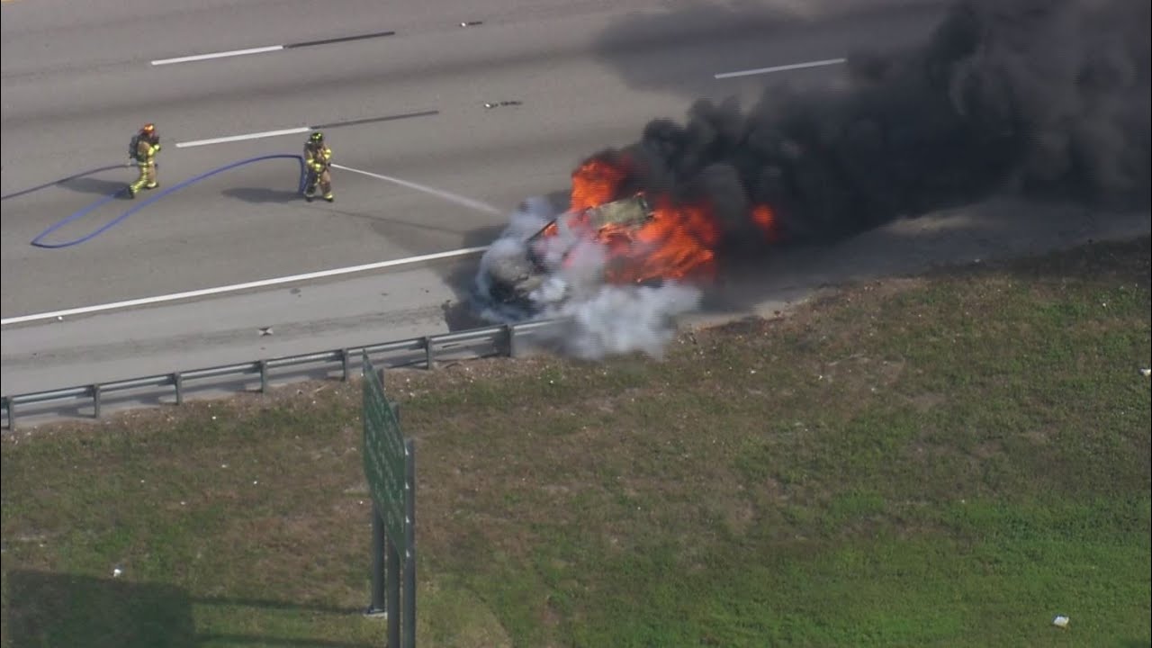 WATCH: Firefighters Extinguish Blaze After Car Bursts Into Flames On Turnpike