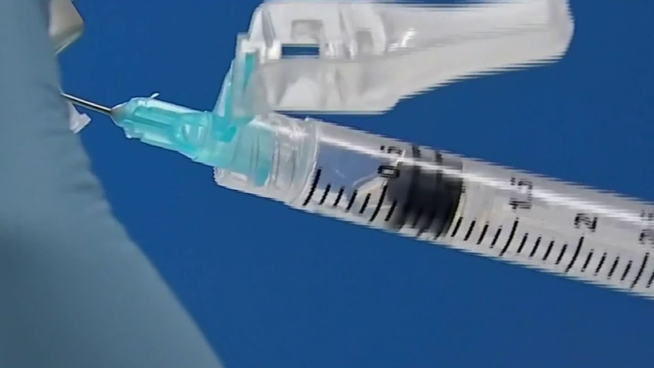 Should you get a COVID booster shot now, or wait for the updated booster?