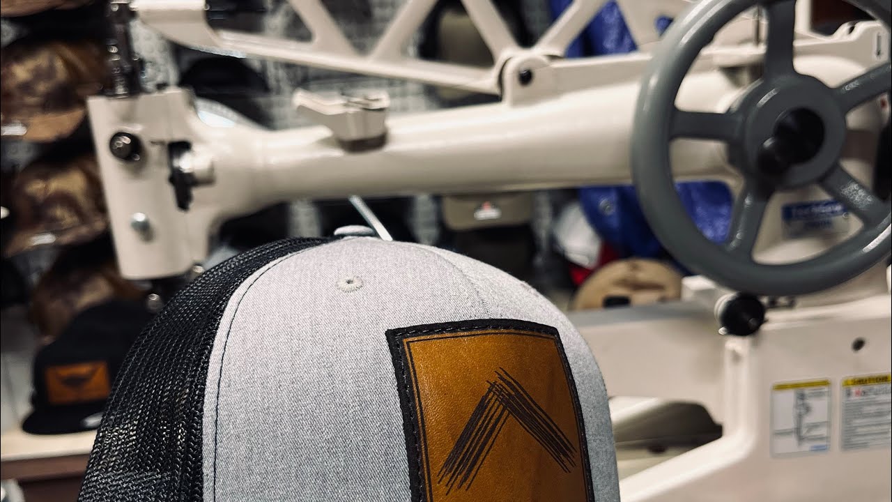 Sewing leather patch on hat using patch sewing machine