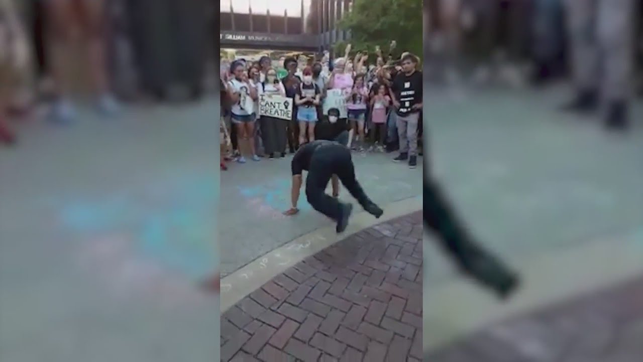 Protesters Gets Served By Police Officer In Breakdancing In A Dance-Off