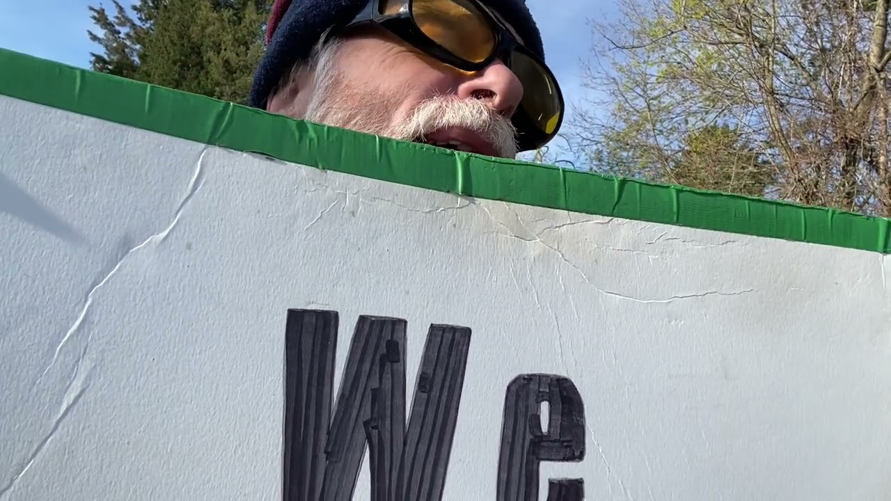 Man With Sign, April 15, 02026