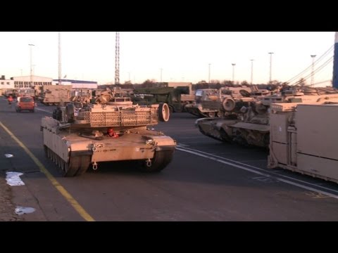 US soldiers and military equipment lands in Germany