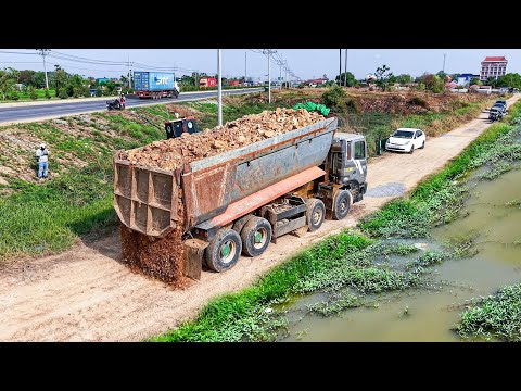 First Start new Project LANDFILL By New Dozer SHANTUI DH17C3 pushing soil with25T Dump truck Dumping