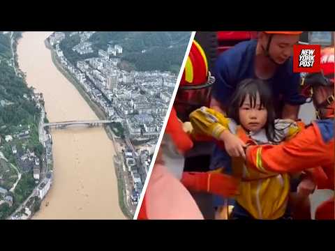 Families in China rescued from 'worst flooding in decades' after being trapped for hours