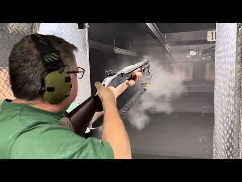 Dad shooting the Mossberg 590A1 retrograde