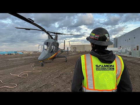 HVAC rooftop equipment lift with a helicopter