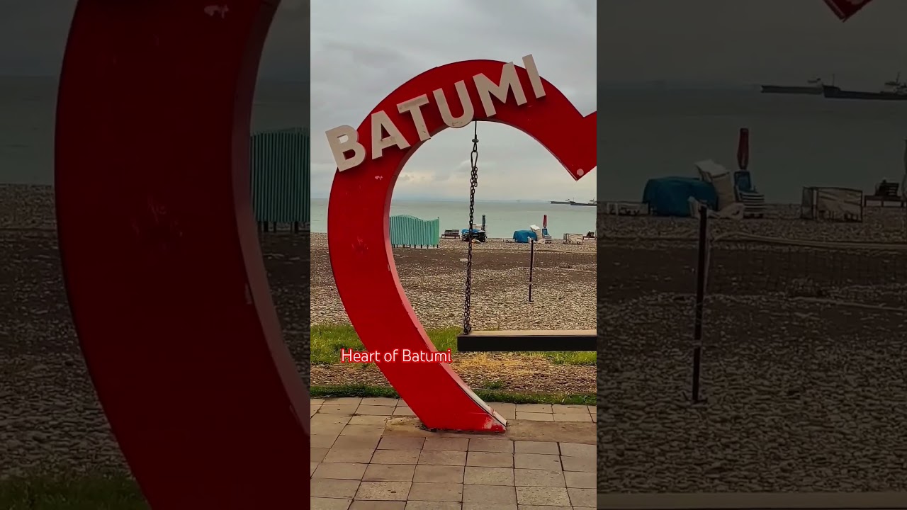 ❤️ Stunning red heart with swings inside—perfect seaside backdrop for romantic photoshoots #love