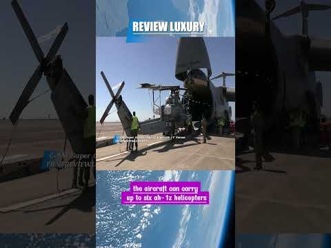 The C-5M Super Galaxy transport aircraft carries two helicopters: an AH-1Z and a UH-1Y Venom.