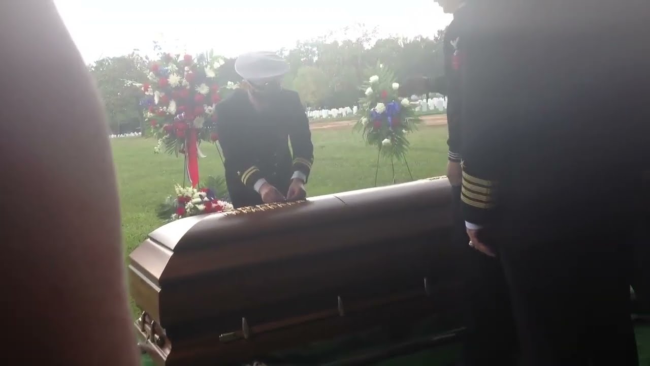 Navy SEALs pound their tridents into Navy SEAL SO1 Pat Feeks' casket at his funeral in 2012