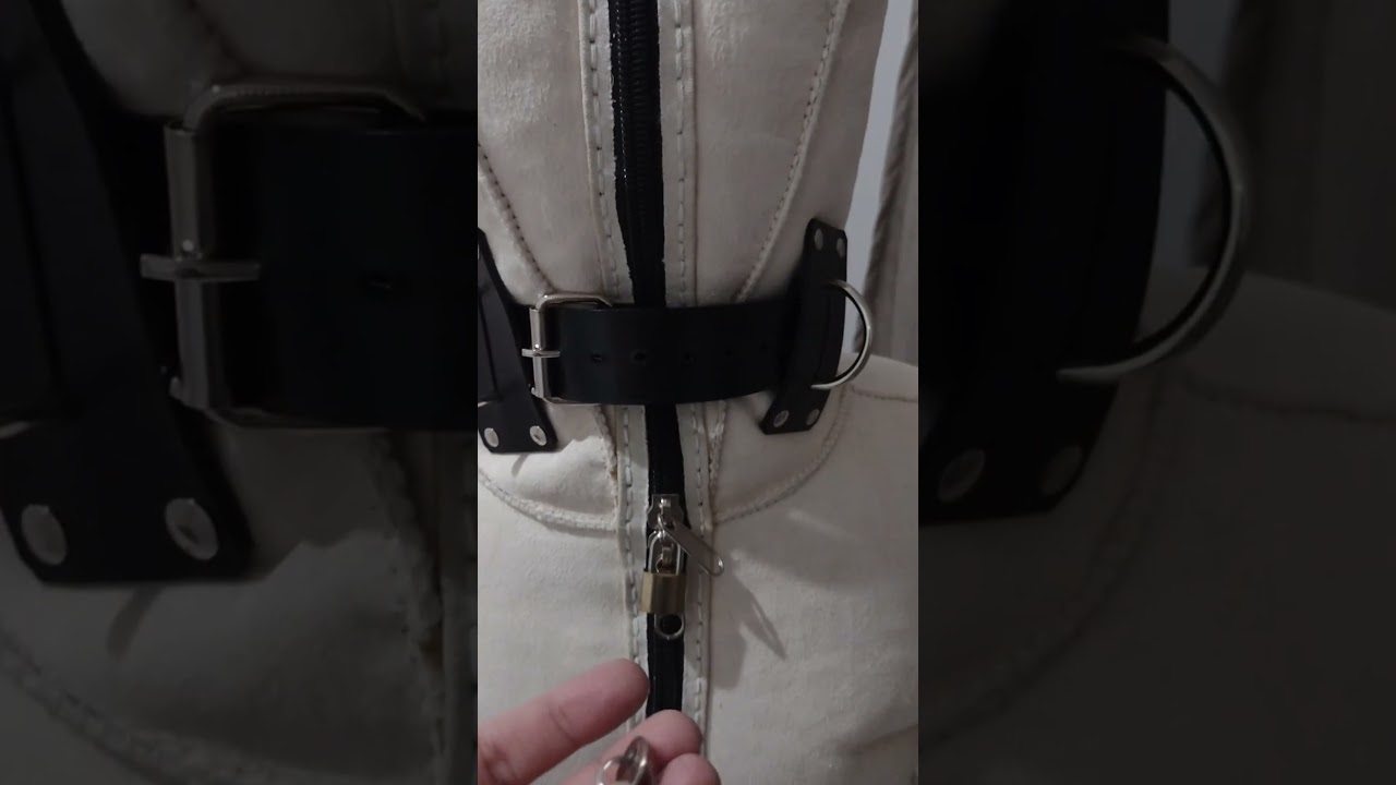 locking furslave into sheepskin bondagesuit
