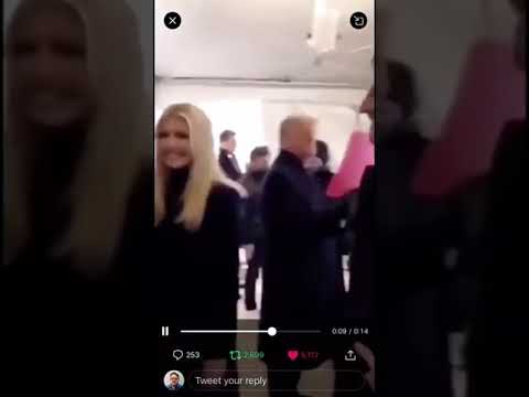 Pay Attention Red folder held up by Trump