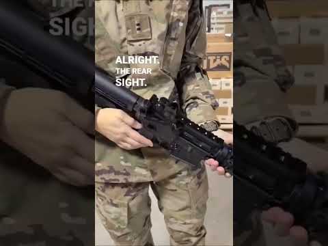 U. S. Army Warrant Officer Handling The M4A1