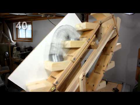 Watch This Slink Climb Down a DIY Wooden Escalator, Forever