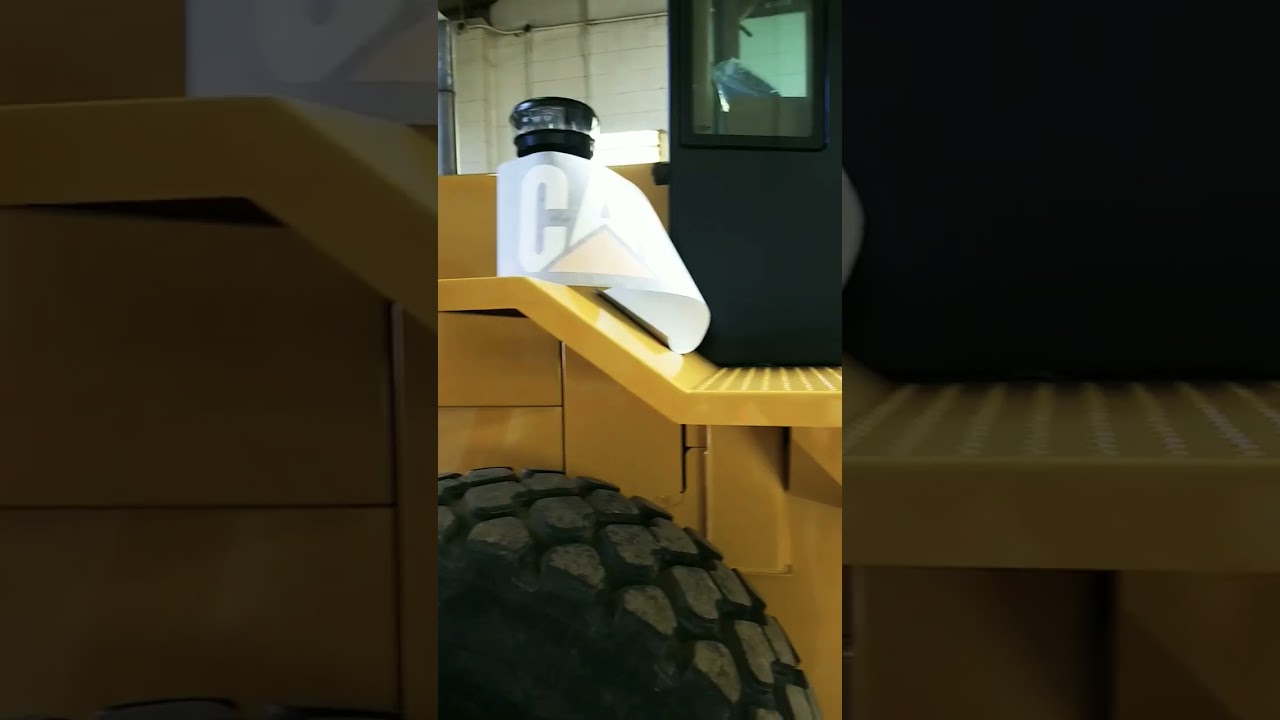 Installing new decals on 938F wheel loader