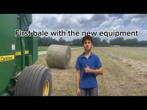Round baling first cut of Bermuda grass