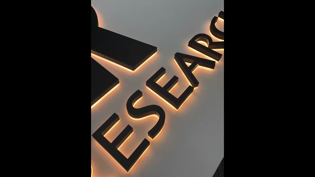 Black Metal Letter Shell with Backlit Glow | Custom LED Halo Signage