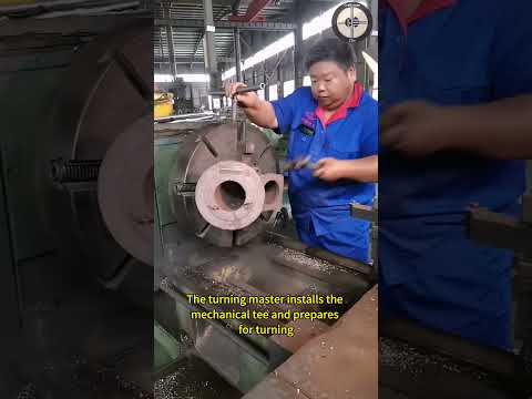 The turning master installs the mechanical tee and prepares for turning