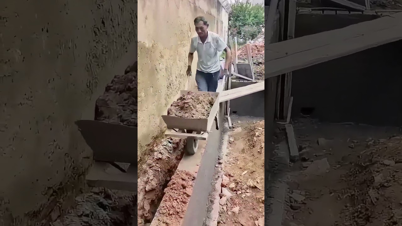 Pushing a Fully Loaded Wheelbarrow Across a Narrow Wooden Bridge - Worker’s Impressive Skill!