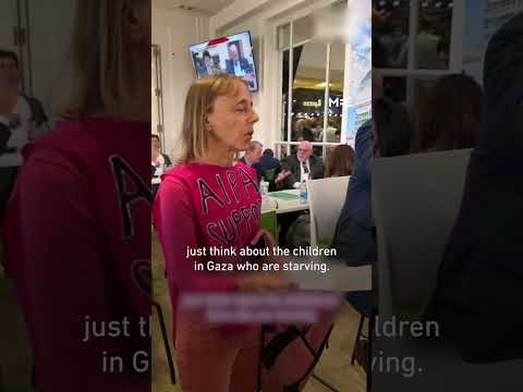 Codepink activist confronts Aipac lobbyists having lunch with pictures of Gaza’s starving children