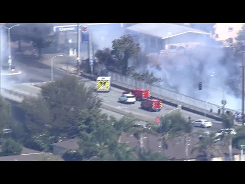 Raw Video: Chopper 5 over fire burning homes in Oakland near 35th Ave. and MacArthur Blvd.