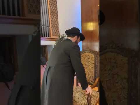 A Mohel performs a Jewish circumcision... Rabbi Heber is looking up to make sure lighting is good
