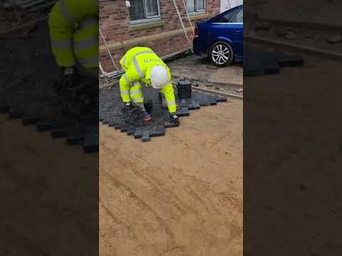 bricklayer demonstrating his block paving skills