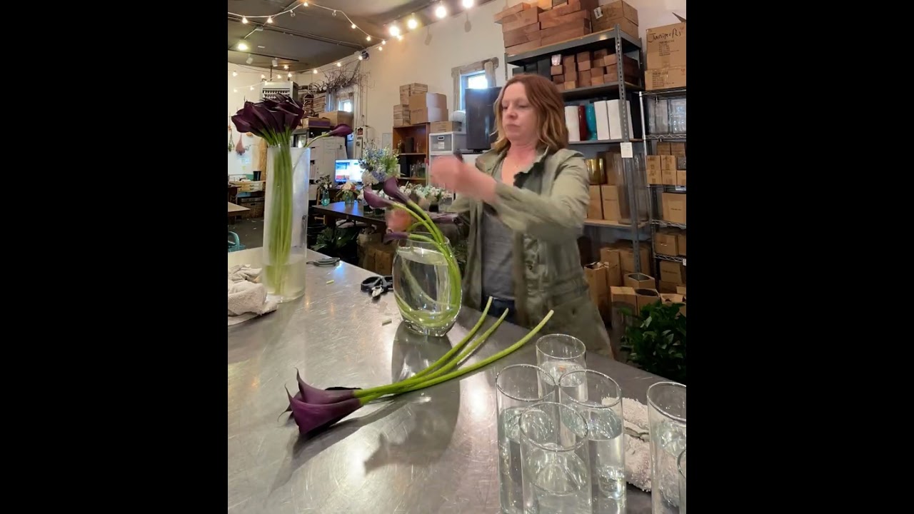 Quick design in a modern vase with calla lilies. #flowers #freshflowers #callalilies