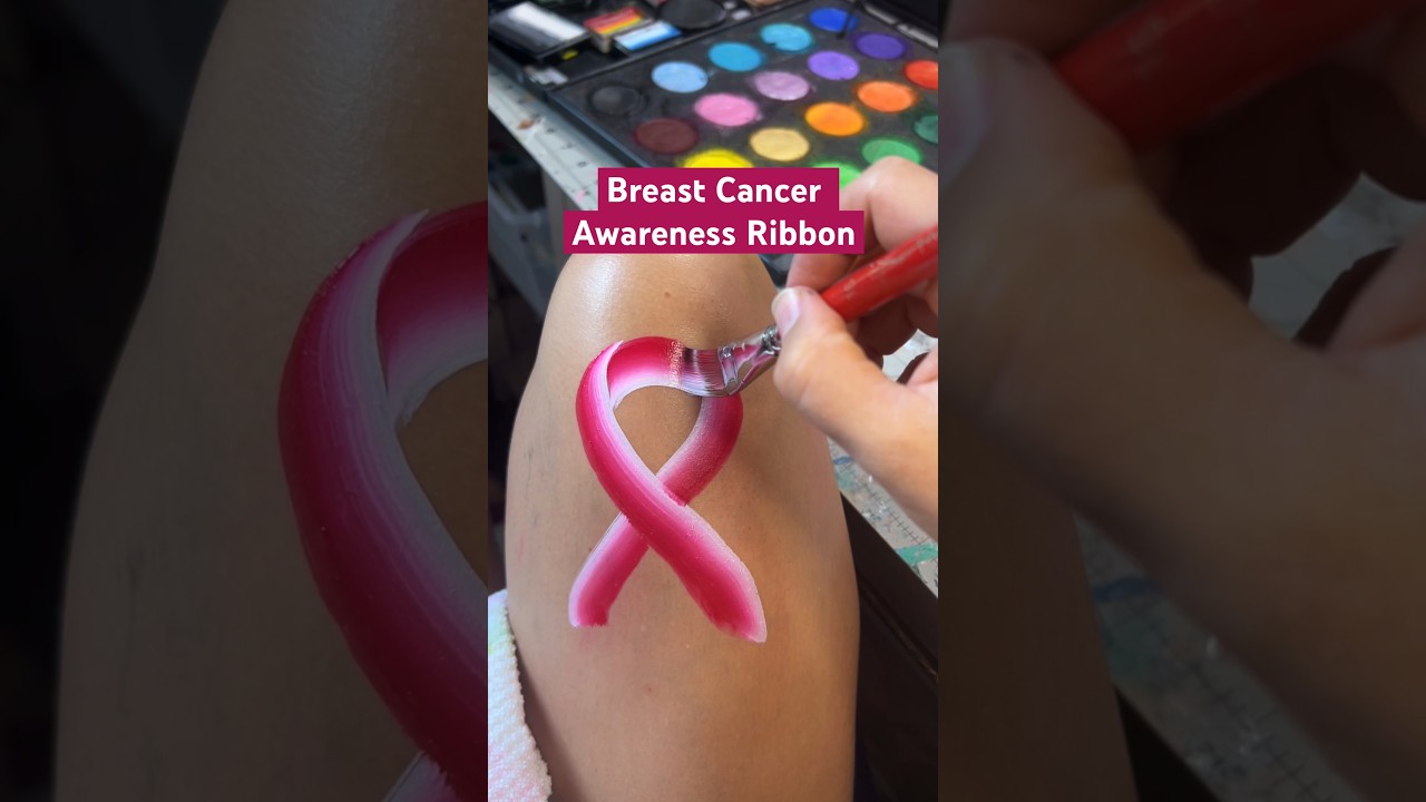 Breast Cancer awareness ribbon in facepaint using pink one stroke. #facepaint #onestrokepainting