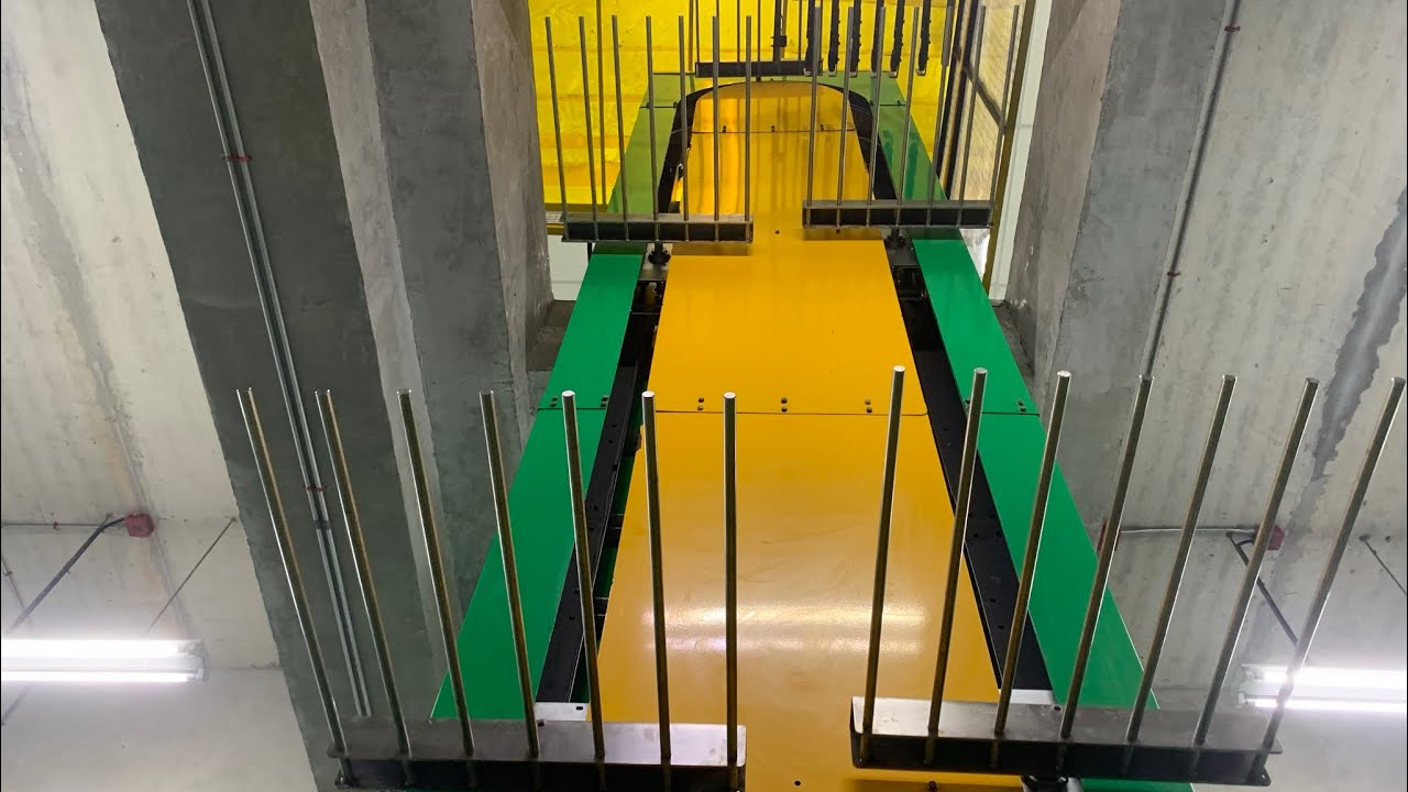Continuous vertical lift conveyor