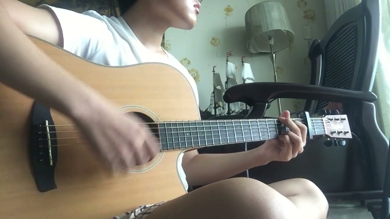 Strumming Wonderwall for 1 minute straight